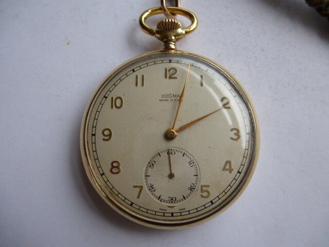 Dogma 14 carat gold pocket watch.